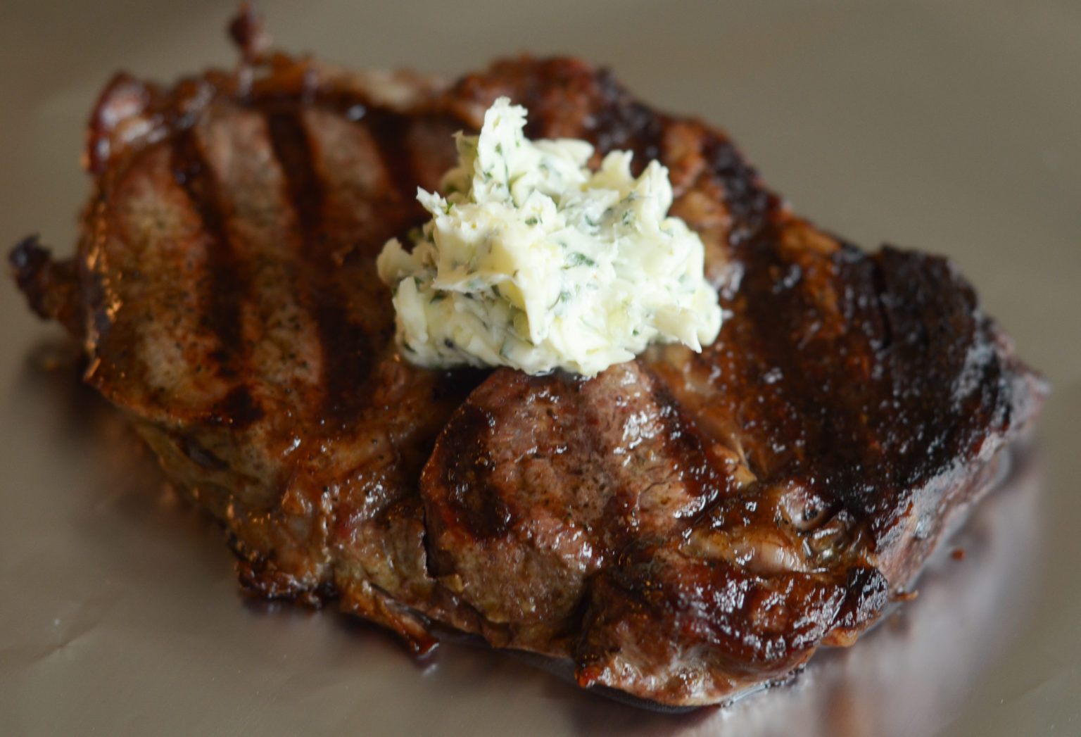 How to Make Garlic Butter Ribeyes on the Grill - Mommy Hates Cooking